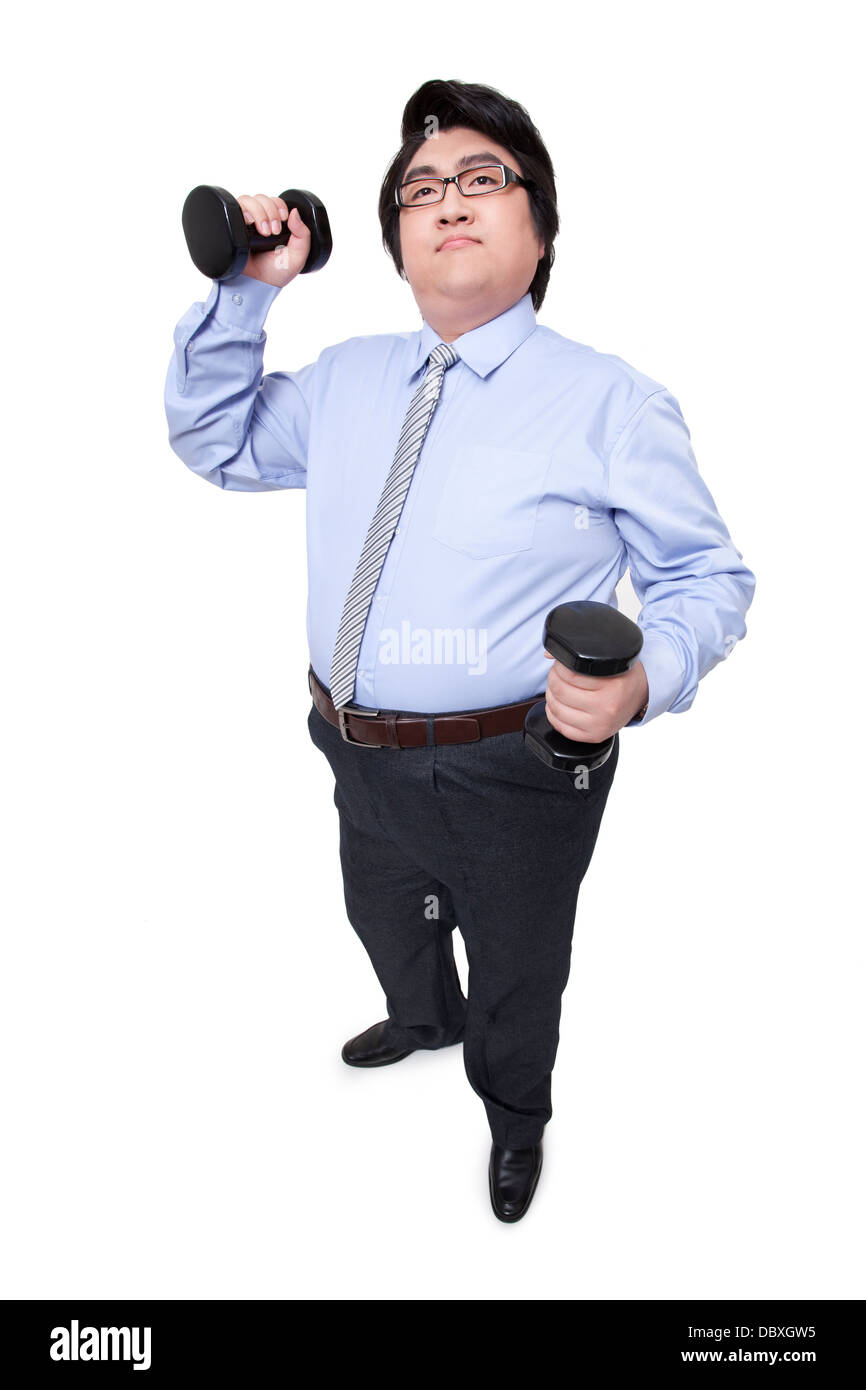 Overweight businessman taking exercise by lifting dumbbell Stock Photo ...