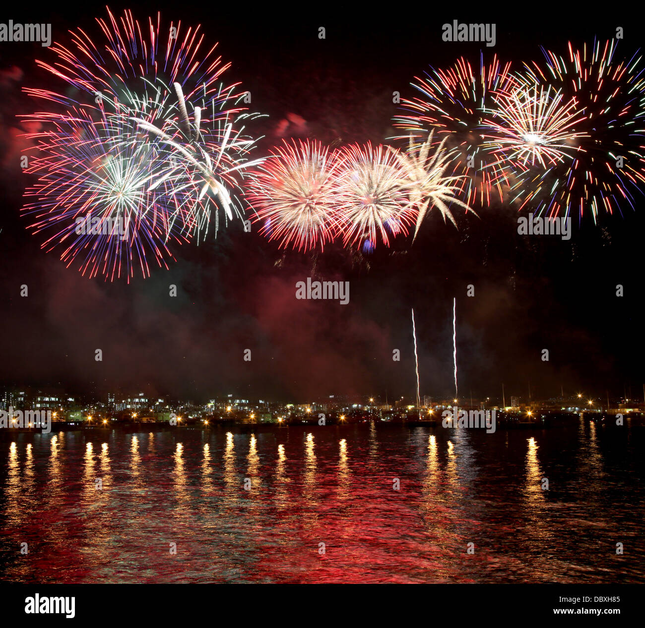 beauty of the fireworks reflect on sea water Stock Photo - Alamy