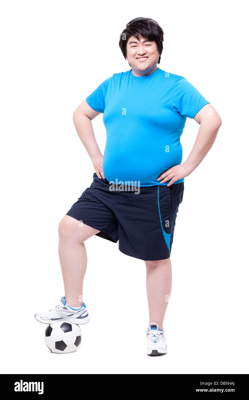 Overweight man with football Stock Photo - Alamy