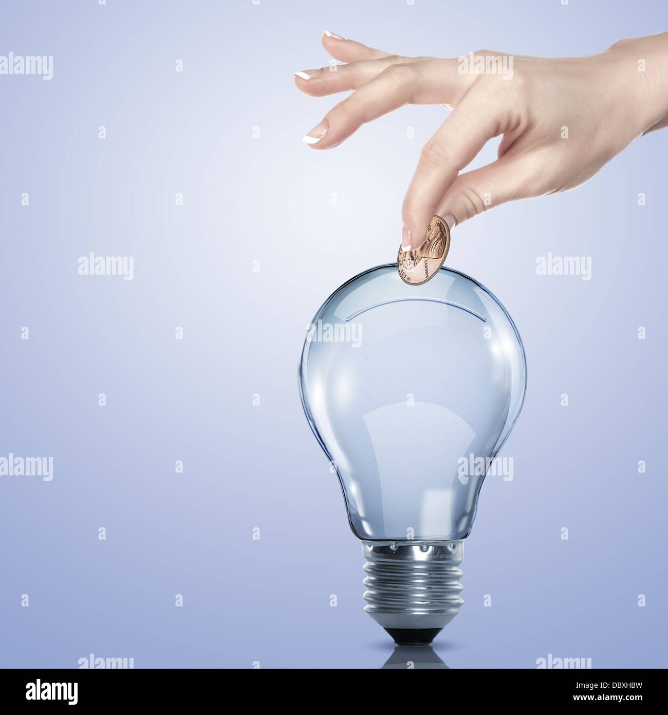 Money inside an electric light bulb Stock Photo - Alamy