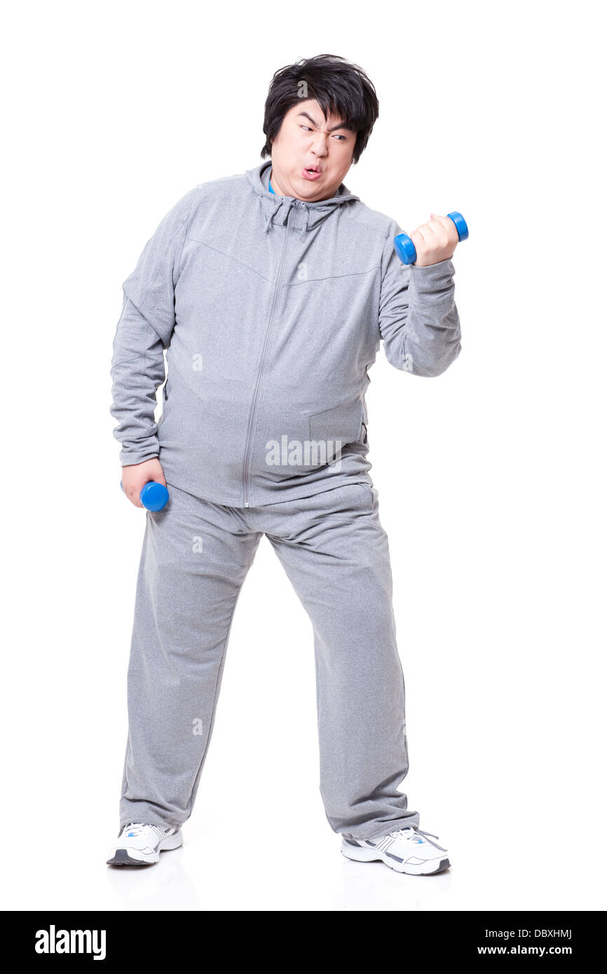 Overweight man taking exercise by lifting dumbbell Stock Photo - Alamy