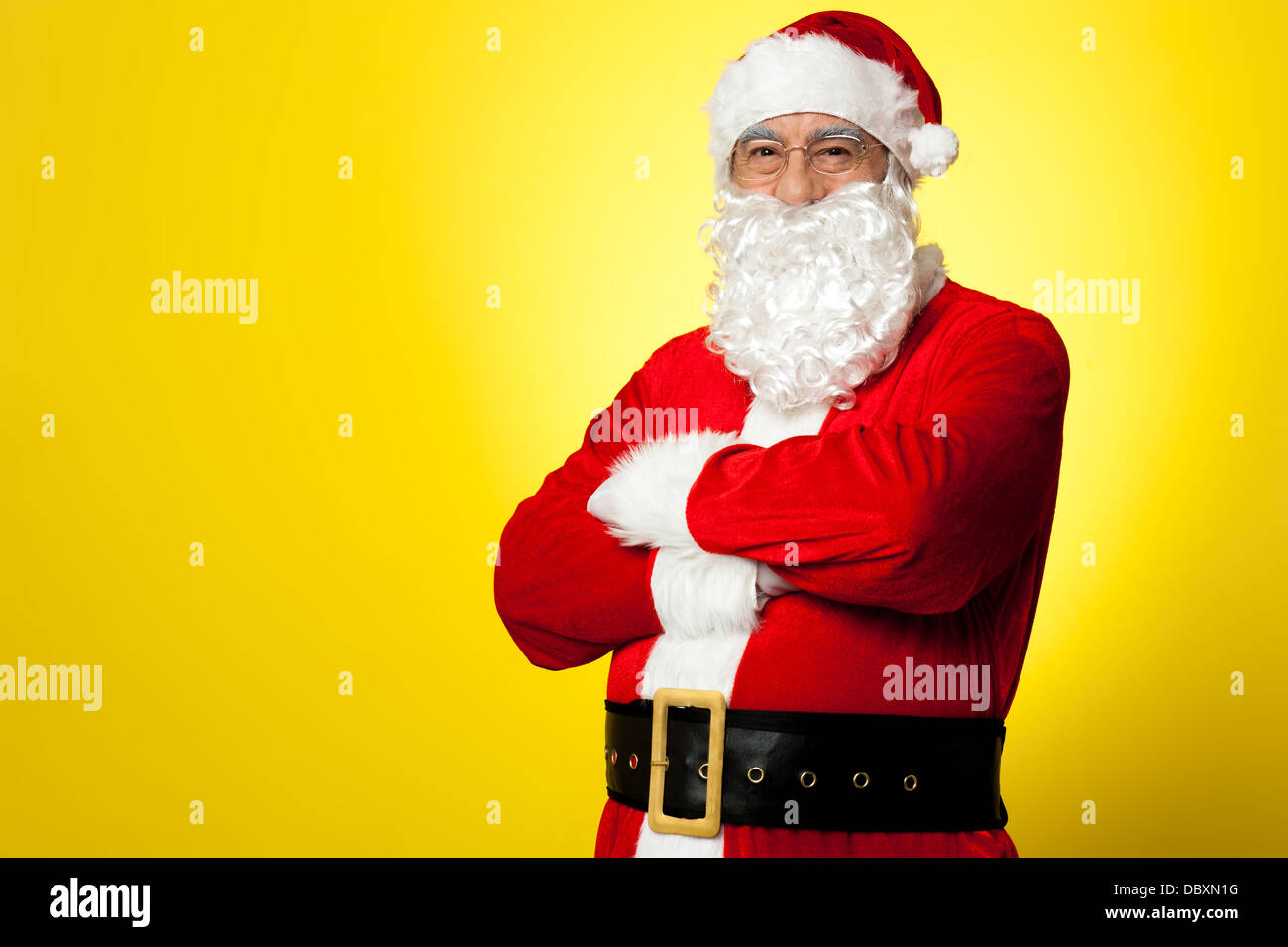 Saint Nick posing confidently against yellow background Stock Photo - Alamy