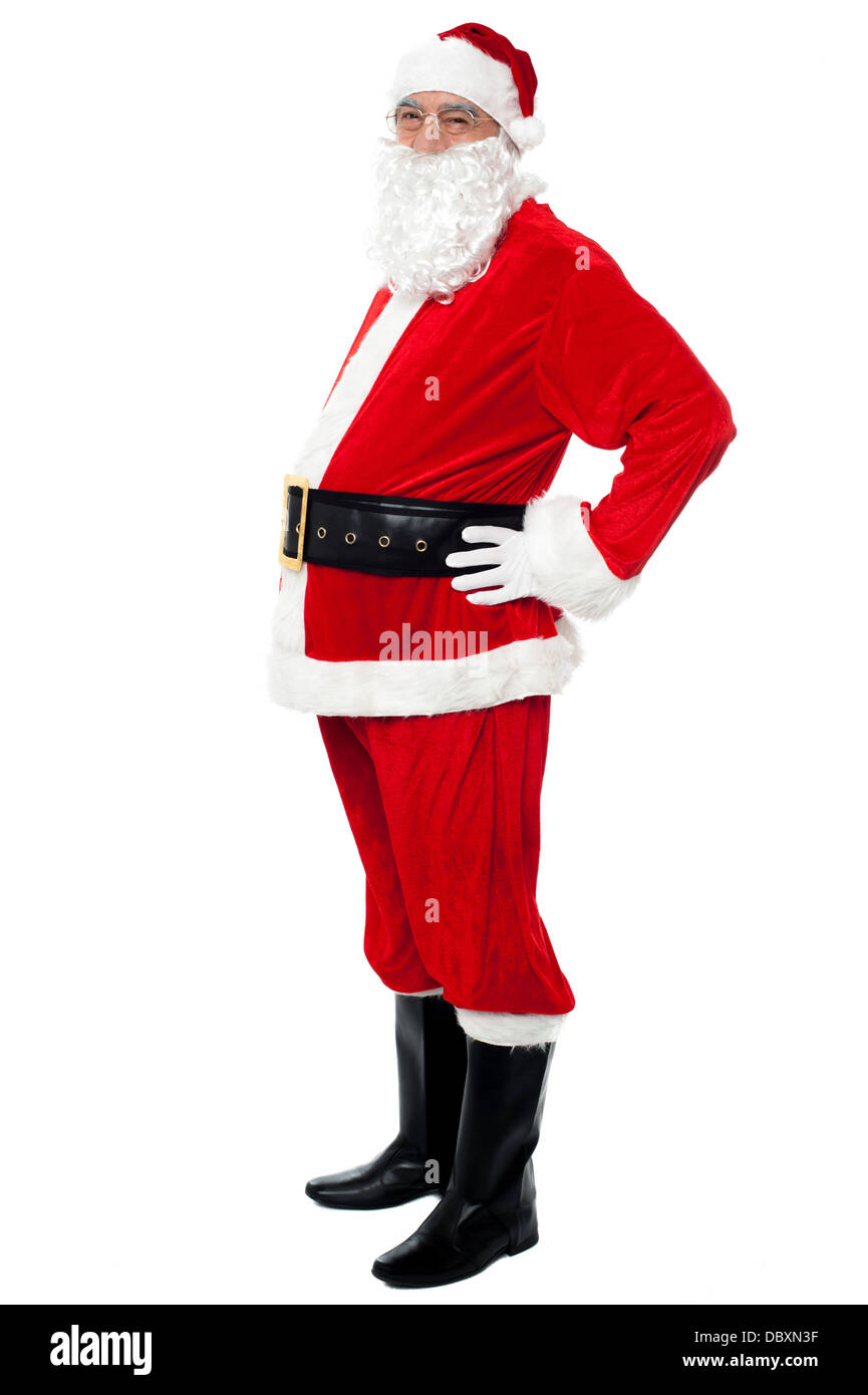 Confident Santa with a big belly posing sideways Stock Photo - Alamy