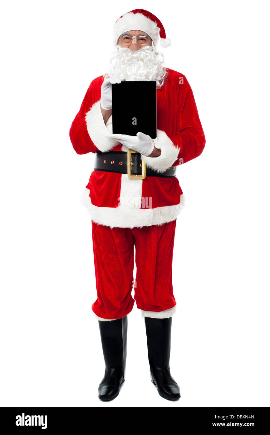 Santa showing newly launched tablet pc Stock Photo - Alamy