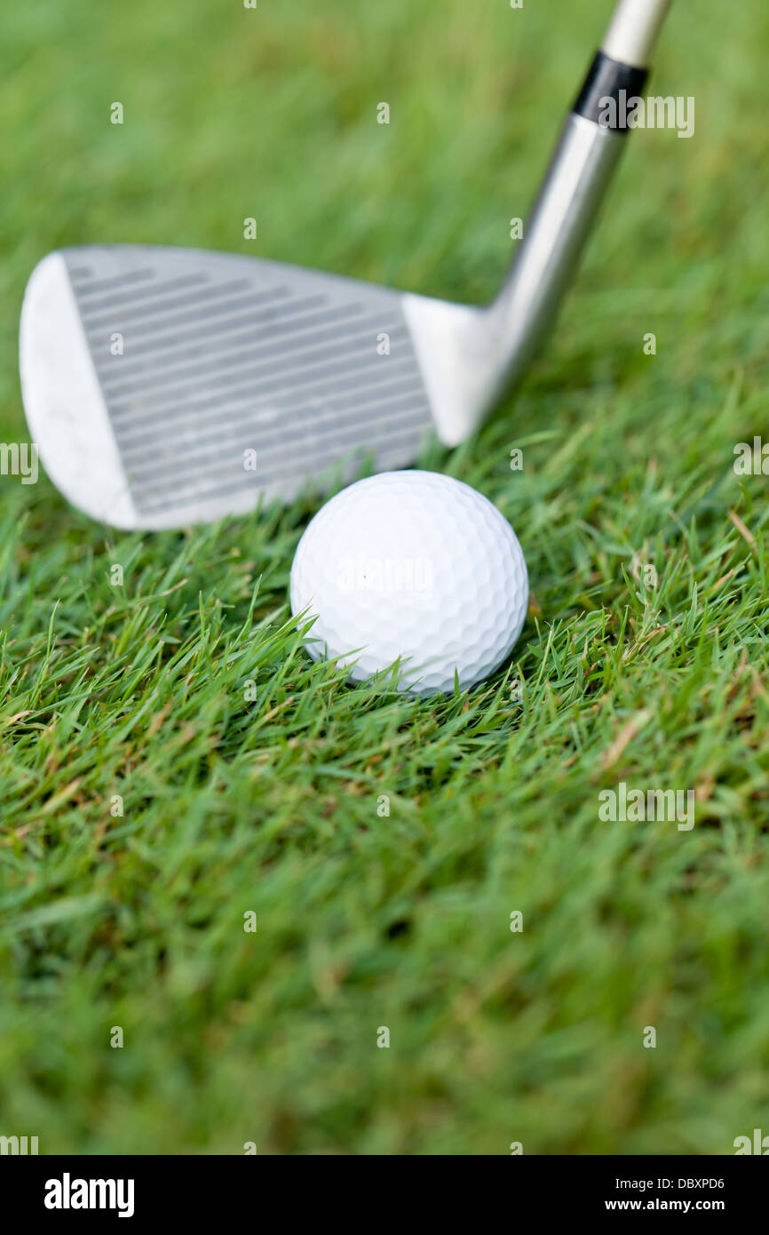 golf ball and iron on green grass detail macro summer outdoor playing ...