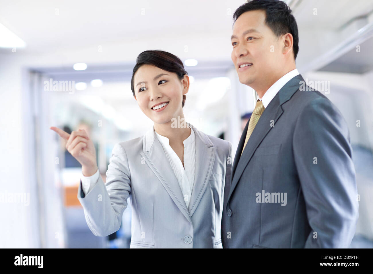 Business associates talking in subway train Stock Photo - Alamy