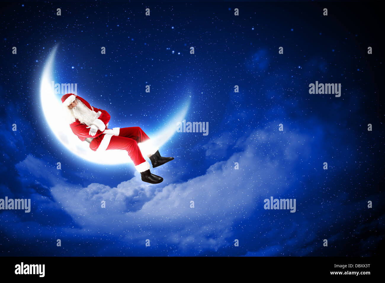 photo of santa claus sitting on the moon Stock Photo - Alamy