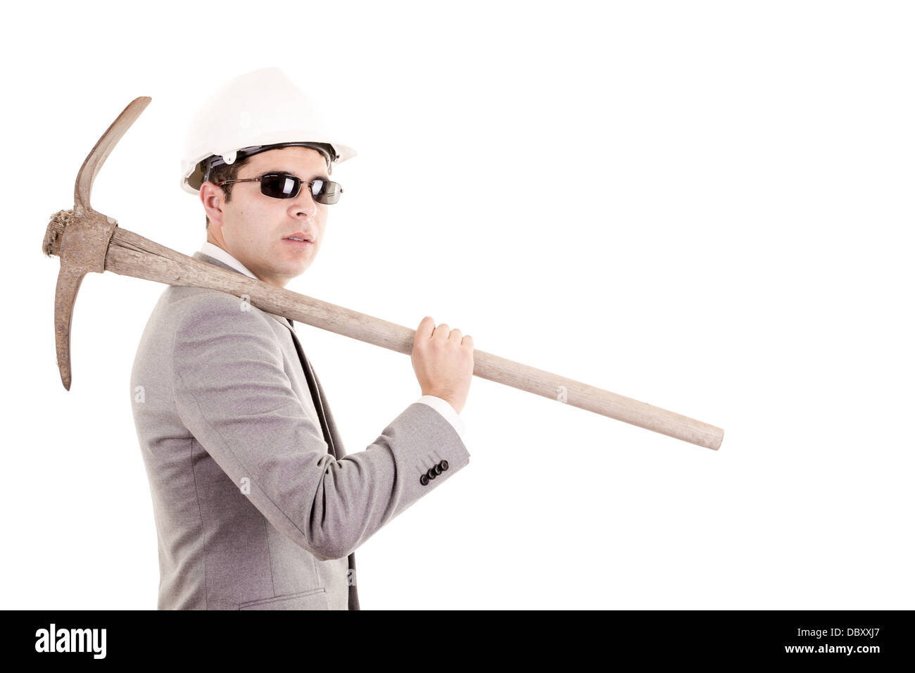 Man in suit displaying pick-axe Stock Photo - Alamy