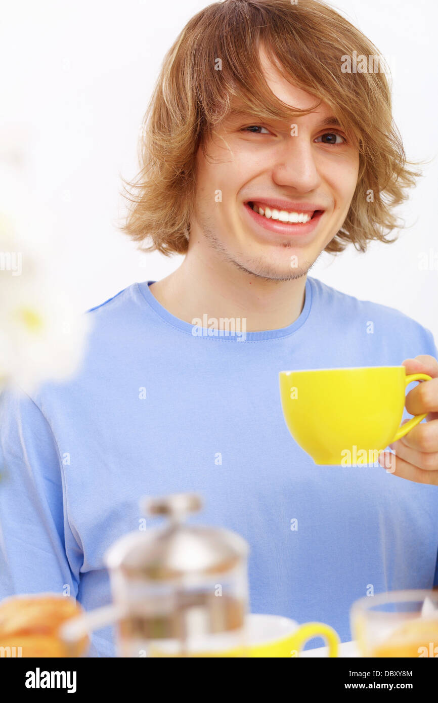 Young happy man drinking tea Stock Photo - Alamy Young happy man drinking tea Stock Photo - Alamy