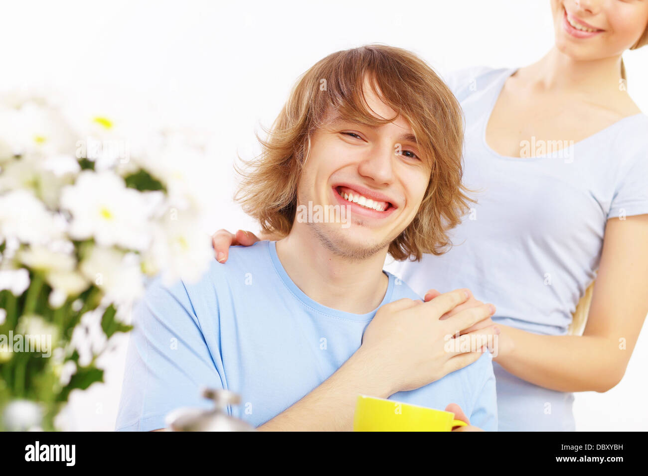 Young happy man drinking tea Stock Photo - Alamy