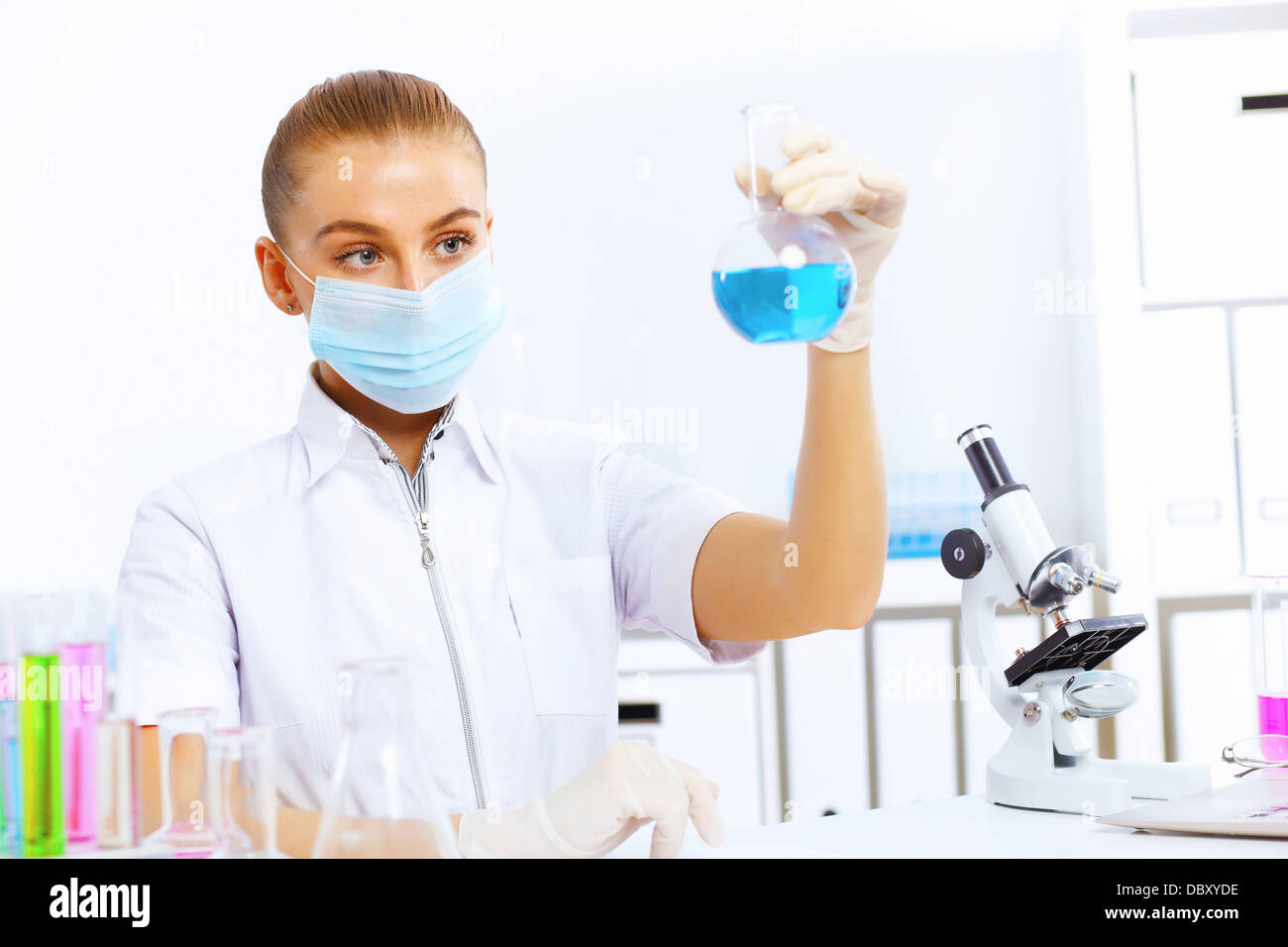 Young female scientist working in laboratory Stock Photo - Alamy