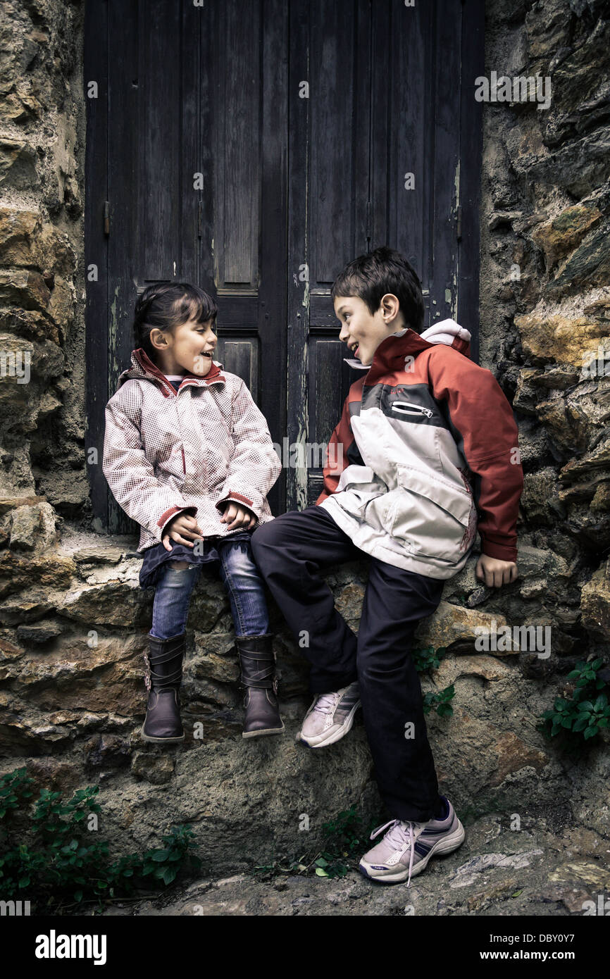 Children having fun outside home Stock Photo - Alamy