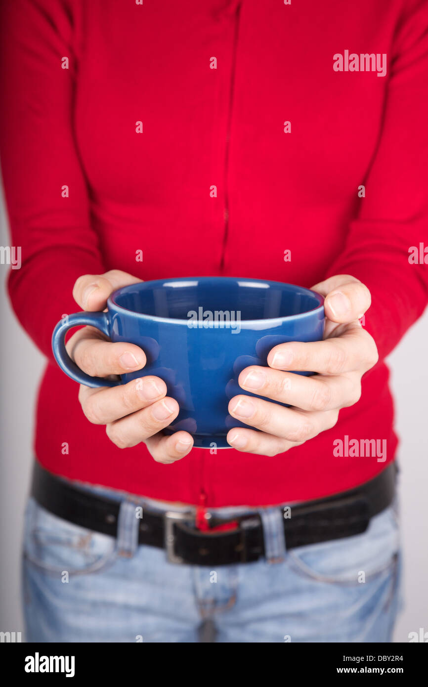 two hands with blue bowl Stock Photo - Alamy