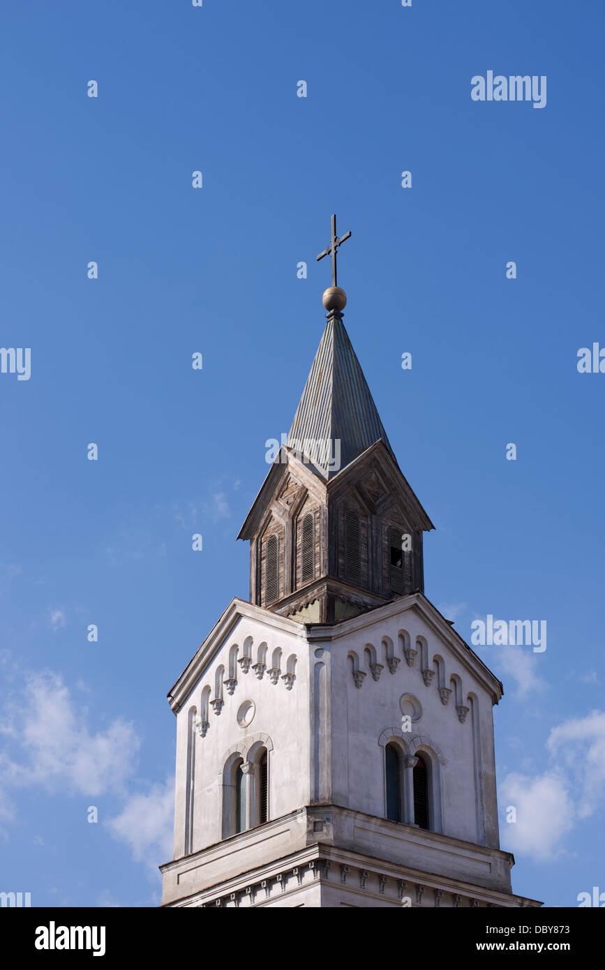 Square church spire with crucifix on top in Bucharest Stock Photo - Alamy