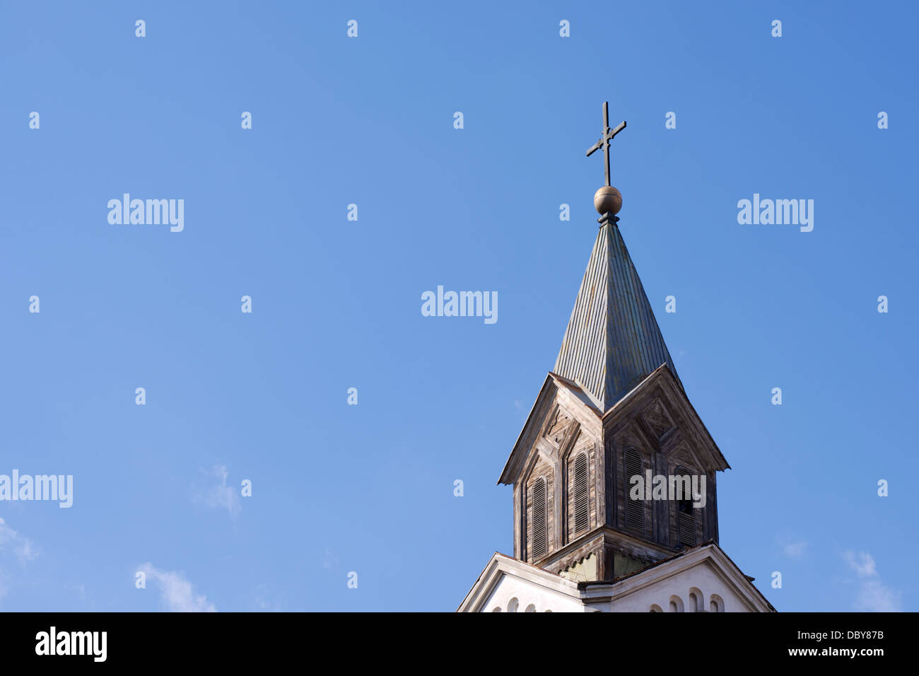 Square church spire with crucifix on top in Bucharest Stock Photo - Alamy