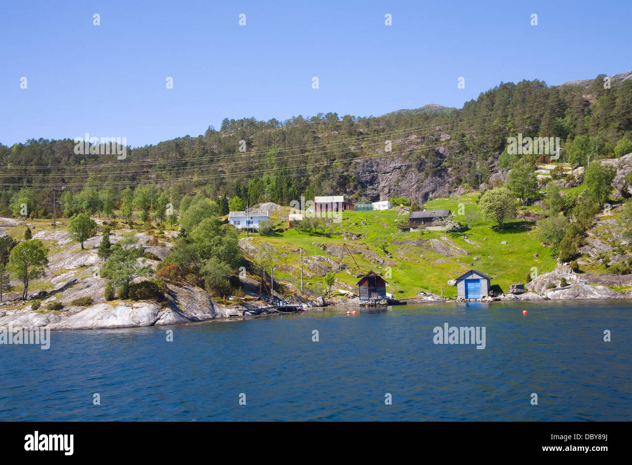 Osteroy Norway Europe Small settlement with waterfront boat houses on ... Osteroy Norway Europe Small settlement with waterfront boat houses on ...