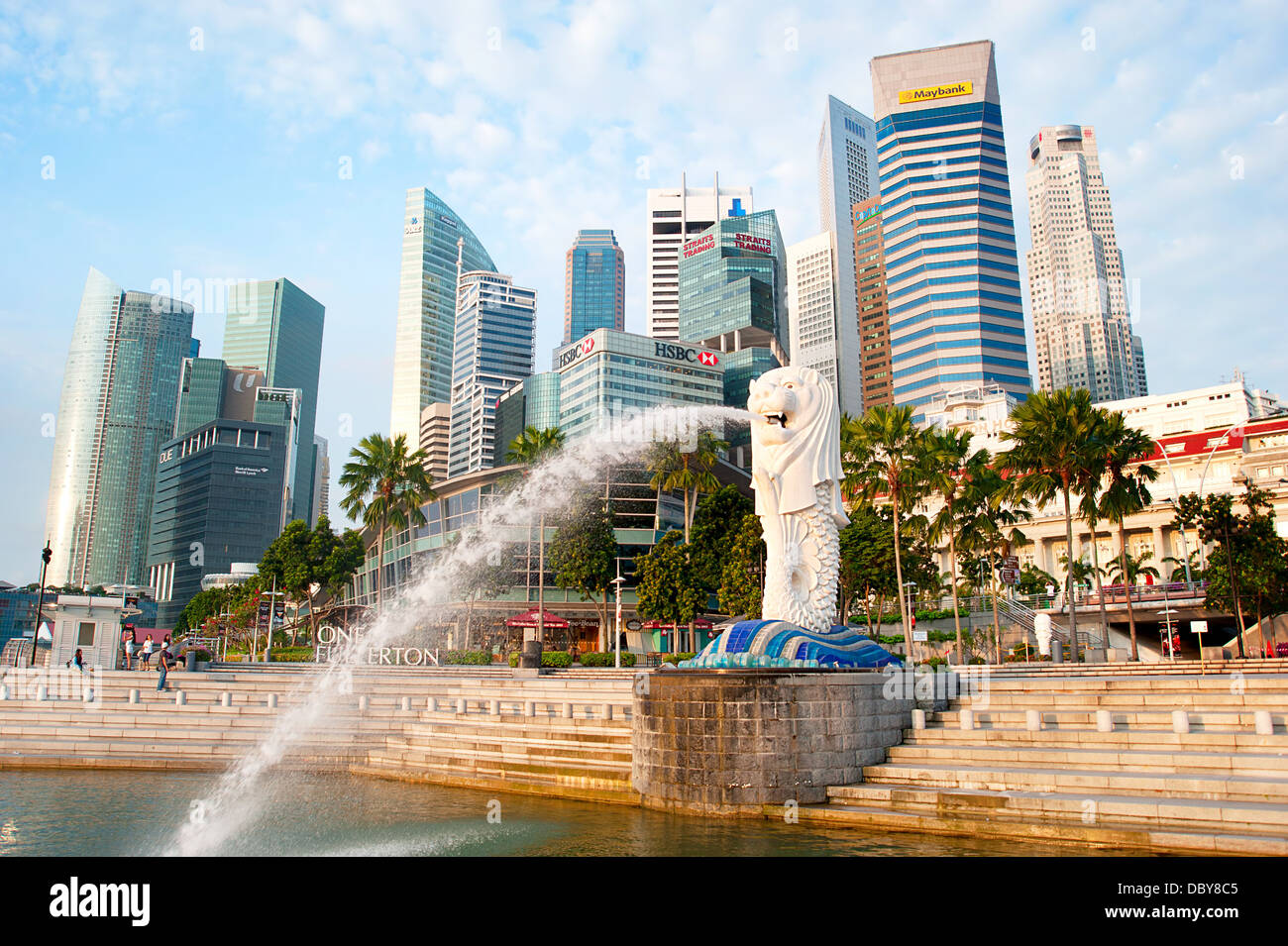 The Merlion fountain spouts water in front of the Singapore downtown ...