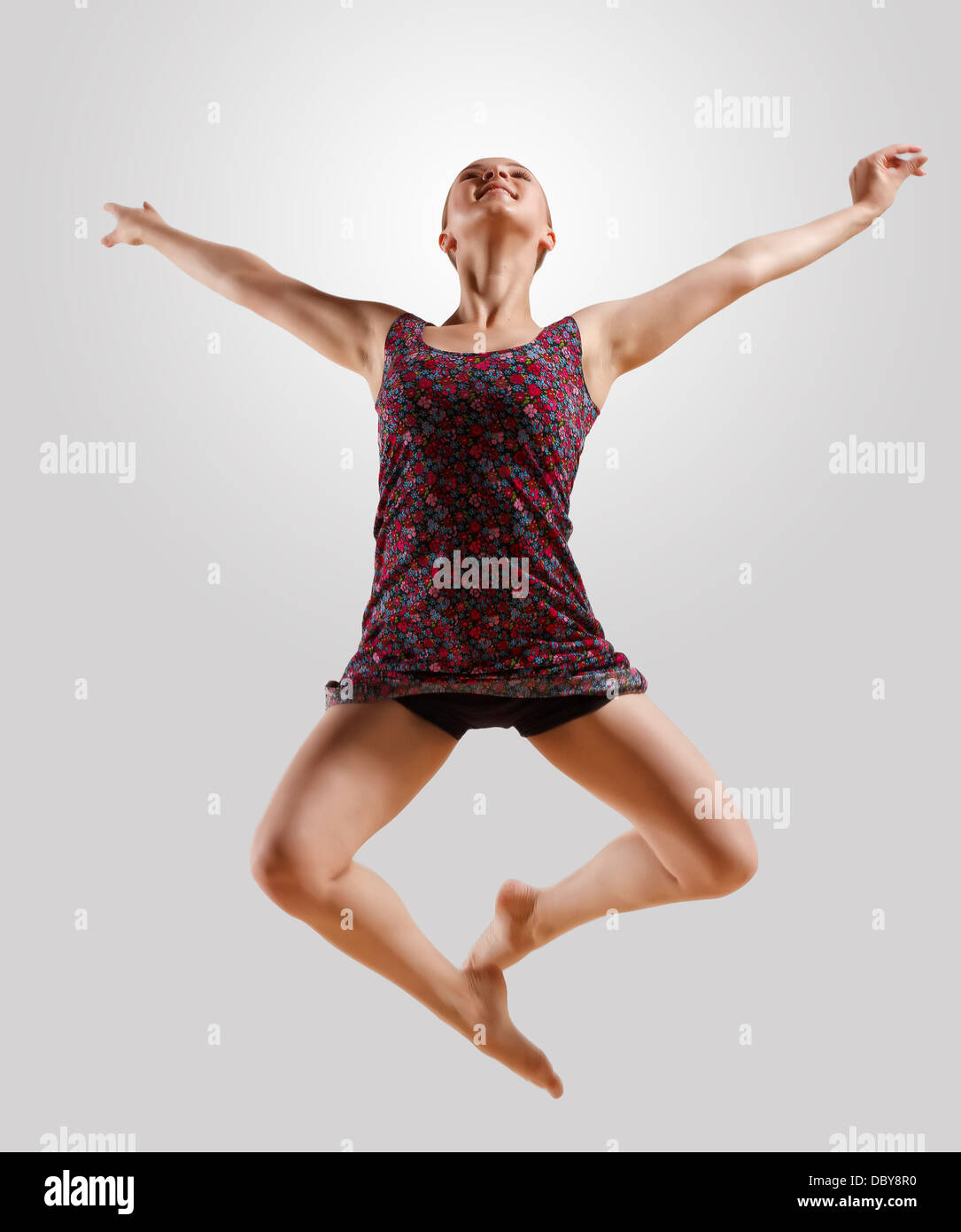 Girl in color dress dancing Stock Photo - Alamy