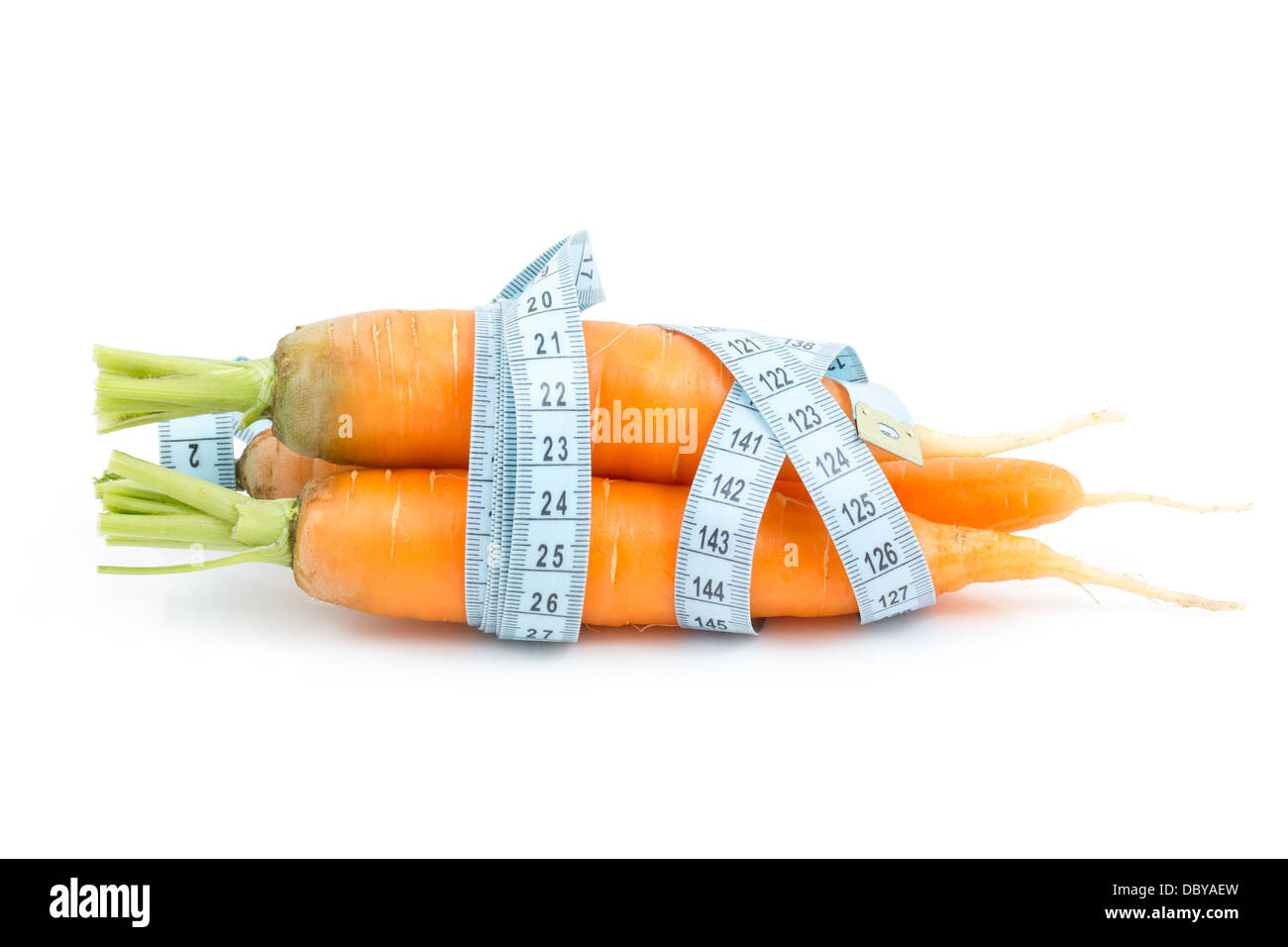 Carrot wrapped by measure tape on the white background Stock Photo - Alamy