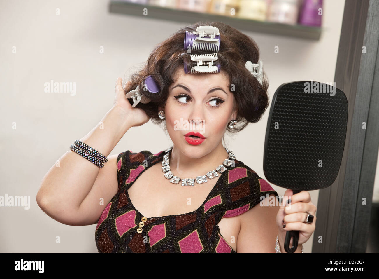 Happy Woman Looking in Mirror Stock Photo - Alamy