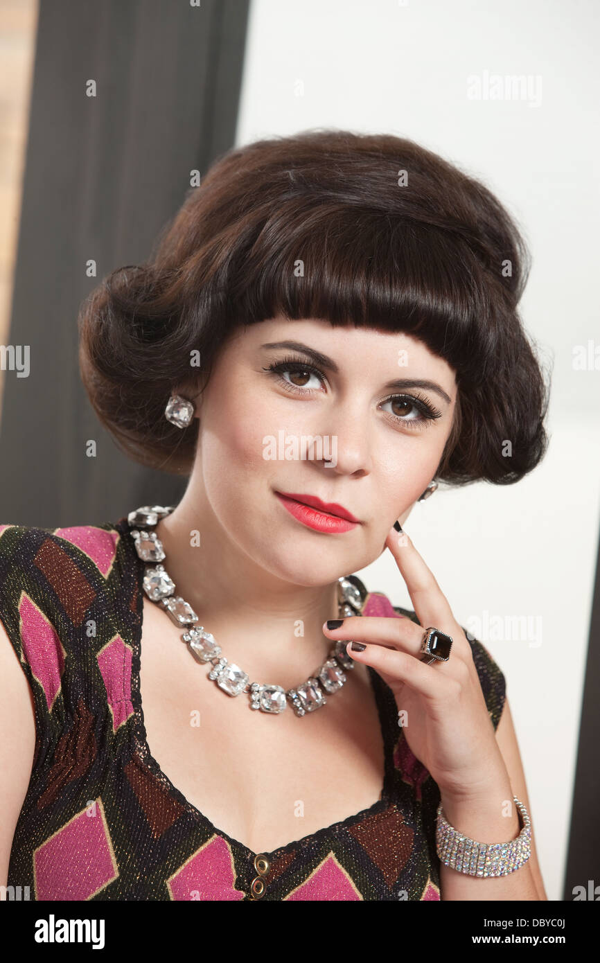 Woman with Finger on Cheek Stock Photo - Alamy