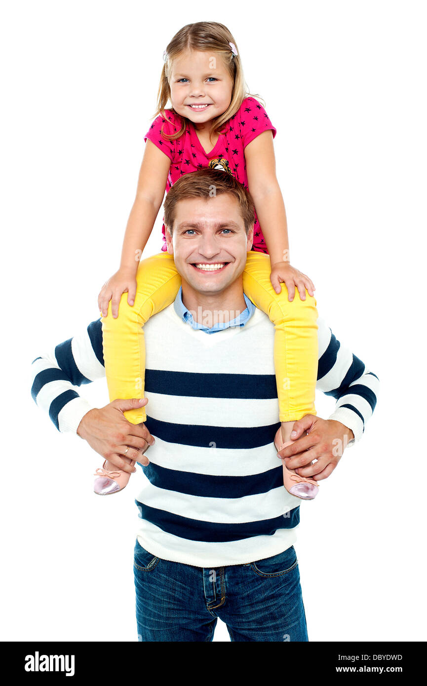 Fun loving kid sitting on her father's shoulders Stock Photo - Alamy