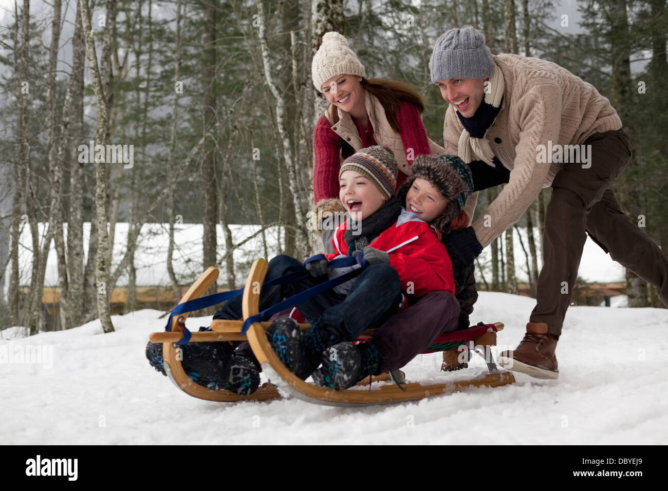 Mother son sledding winter entertainment hi-res stock photography and ...