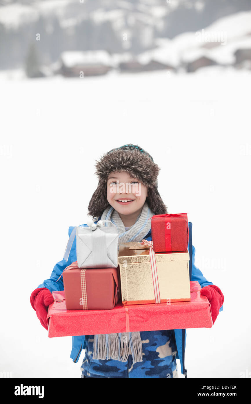 Boy carrying gifts hi-res stock photography and images - Alamy