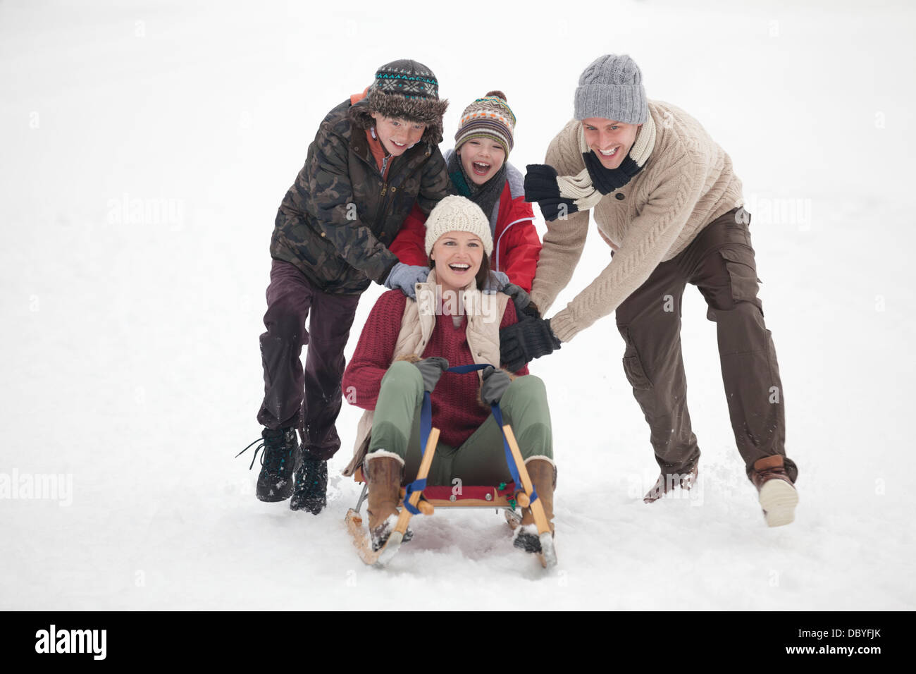 Boy pushing sled hi-res stock photography and images - Alamy