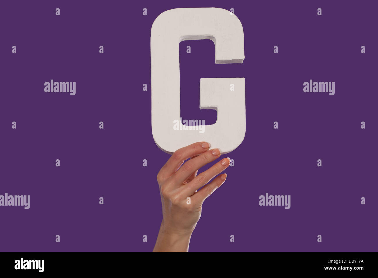 Hand holding letter from alphabet hi-res stock photography and images ...