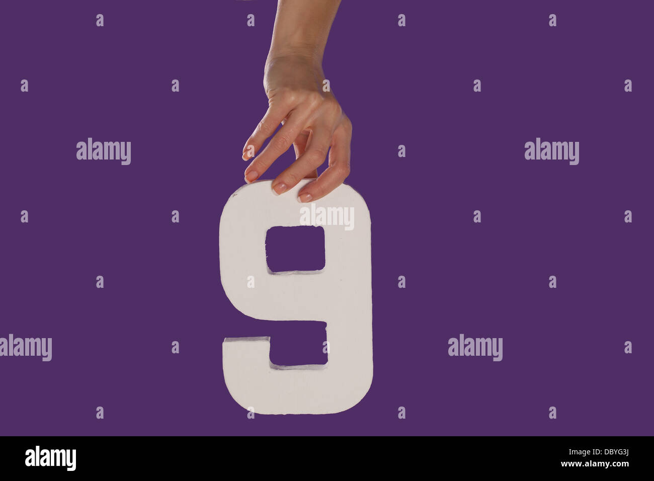 Female hand holding up the number 6 from the top Stock Photo - Alamy