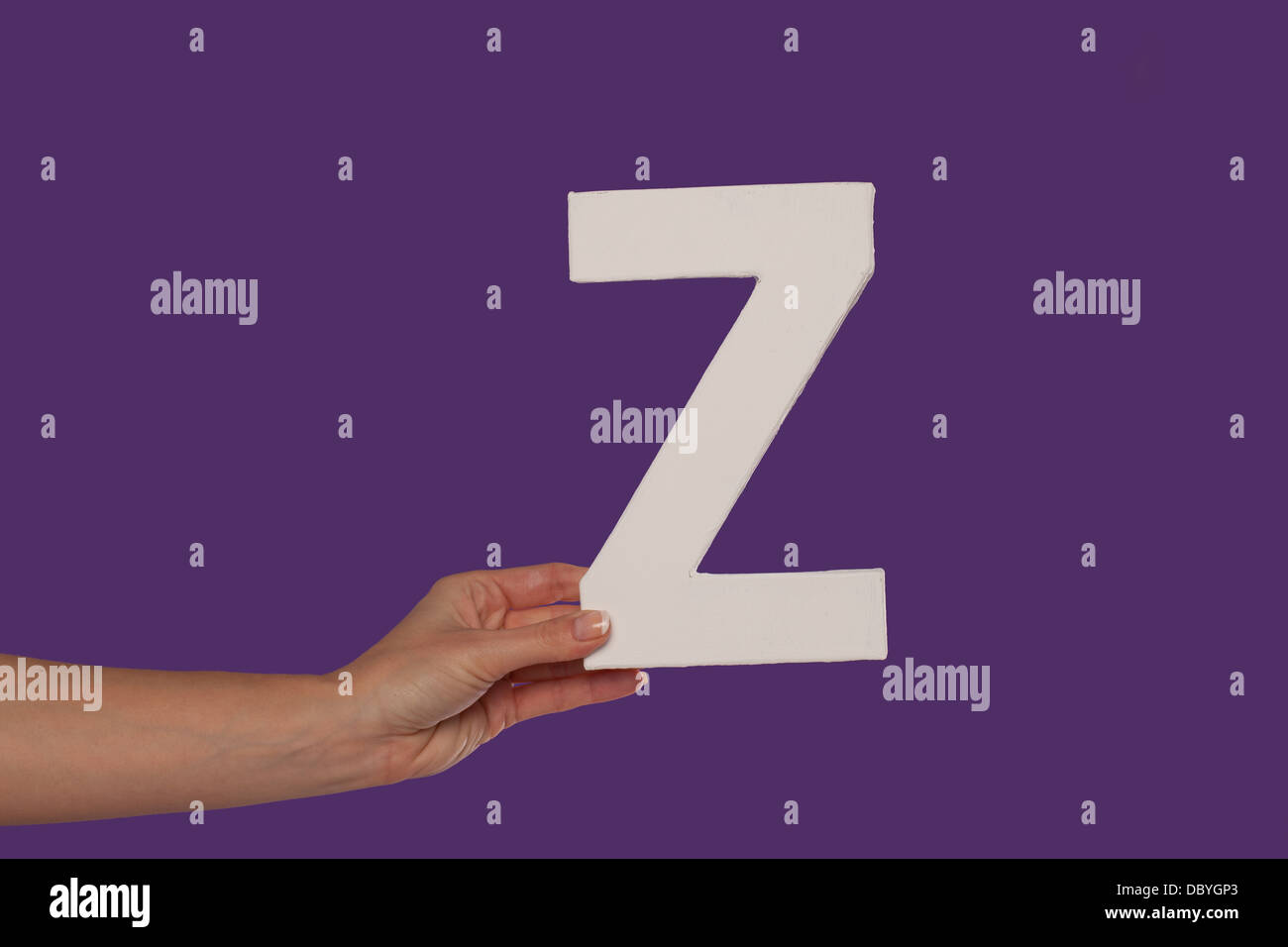 Female hand holding up the letter Z from the left Stock Photo - Alamy