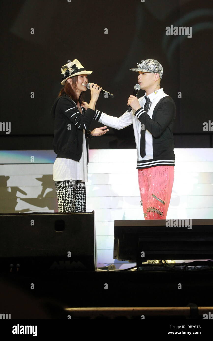 Guangzhou, China. 4th Aug, 2013. Singer Justin Lo holds his personal ...