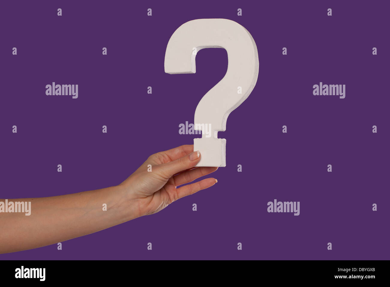 Female hand holding up a question mark from the left Stock Photo - Alamy