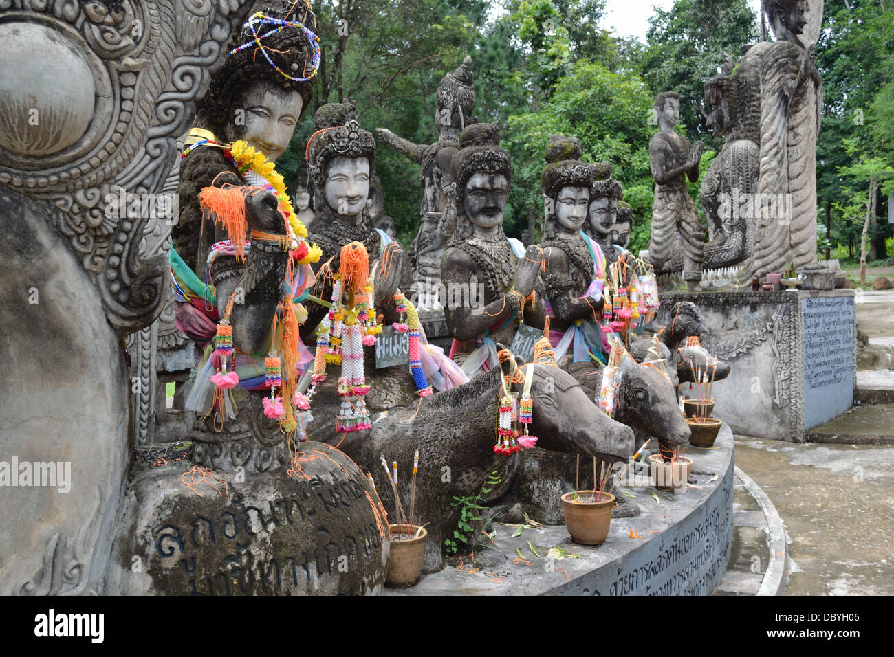 Good luck bracelets and garlands on statues in Sala Kuw Ku - Nongkhai ...