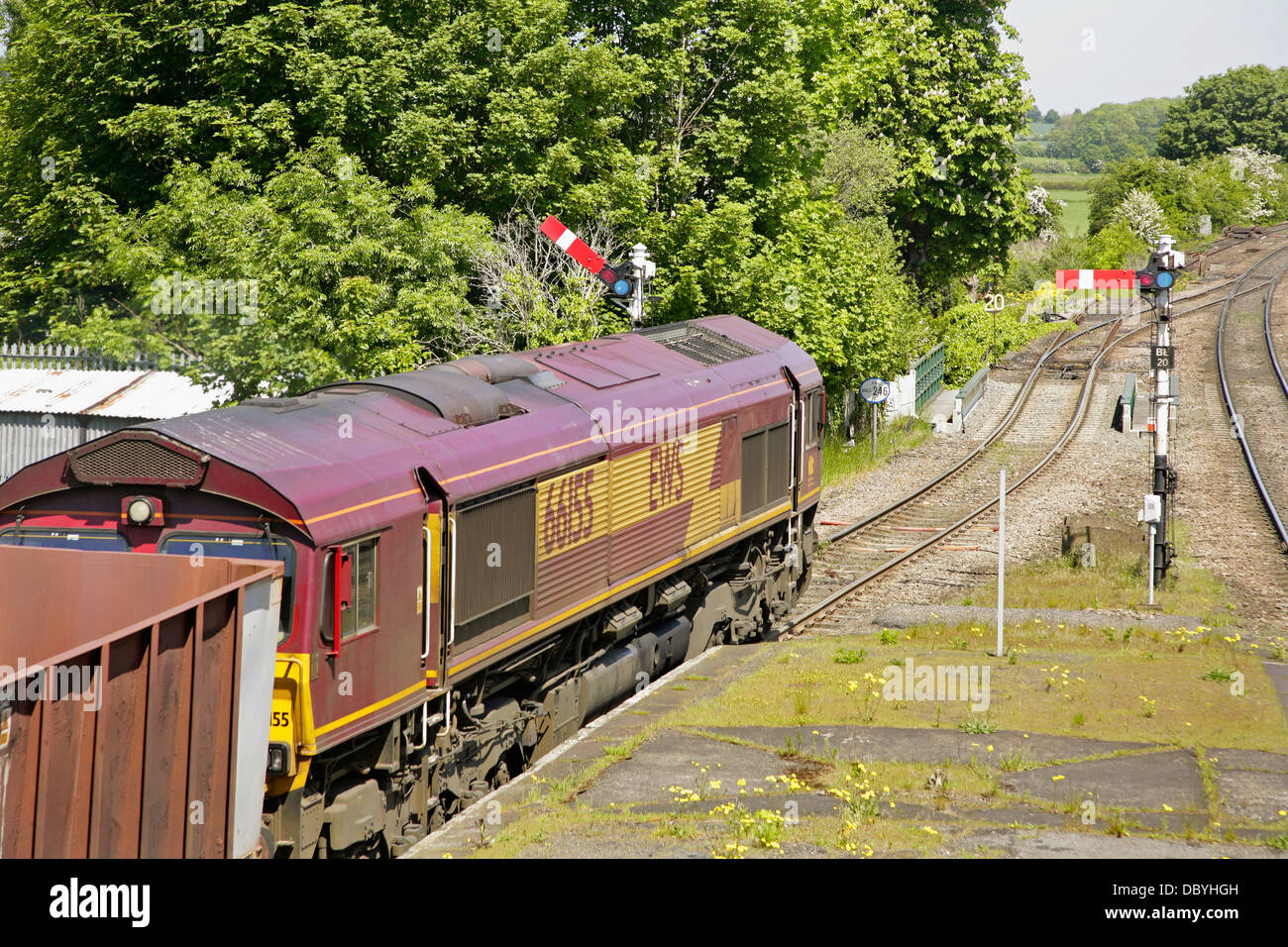 Class 66 diesel locomotive 66155 with train of empty wagons, passing ...