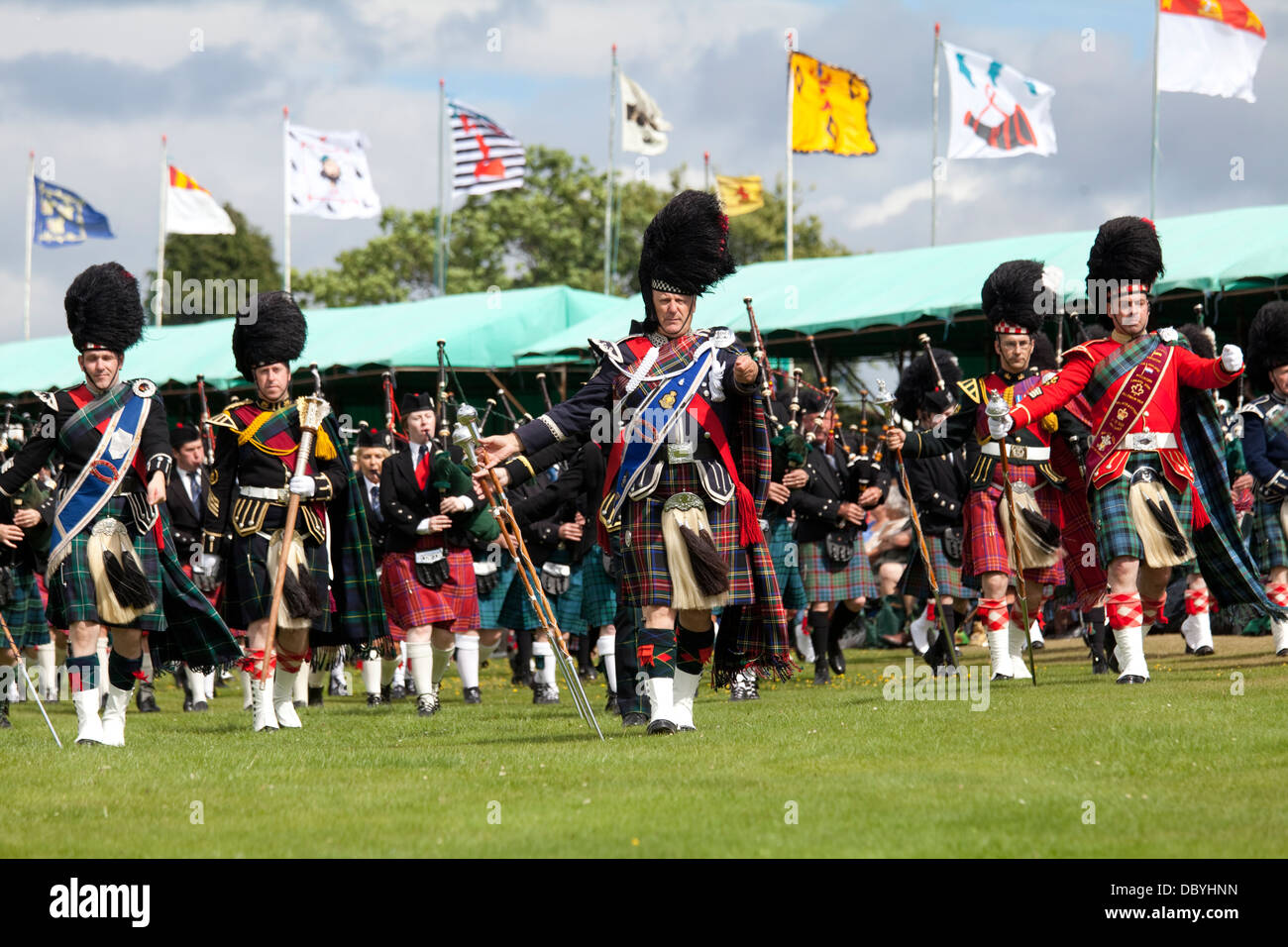 Aboyne, Scotland - August 3rd, 2013: Massed pipe bands entering the ...