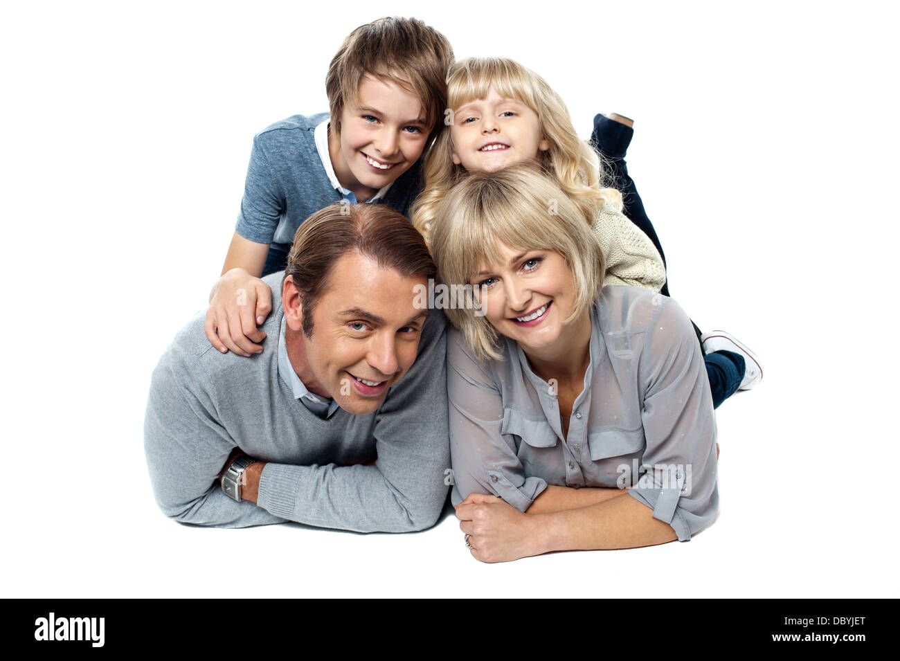 Adorable young kids piled on top of their parents Stock Photo - Alamy