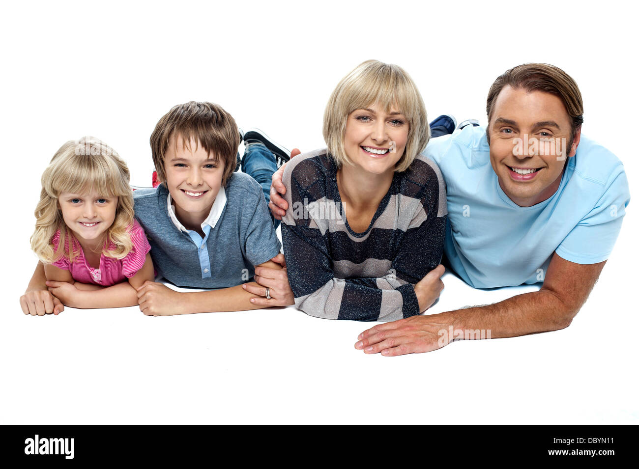 Smiling family of four relaxing on white background Stock Photo - Alamy