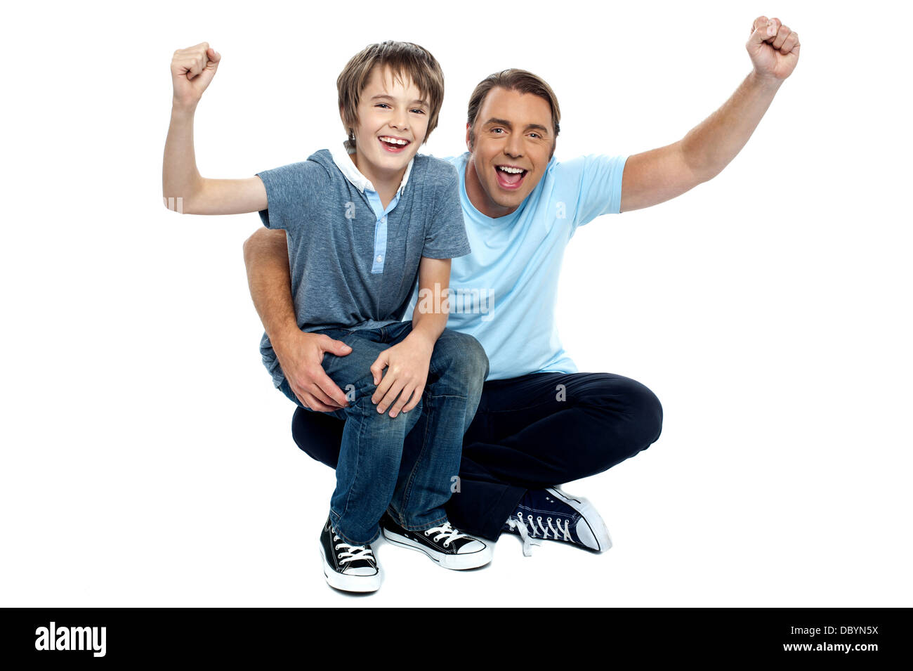 Joyous father and son cheering loud Stock Photo - Alamy
