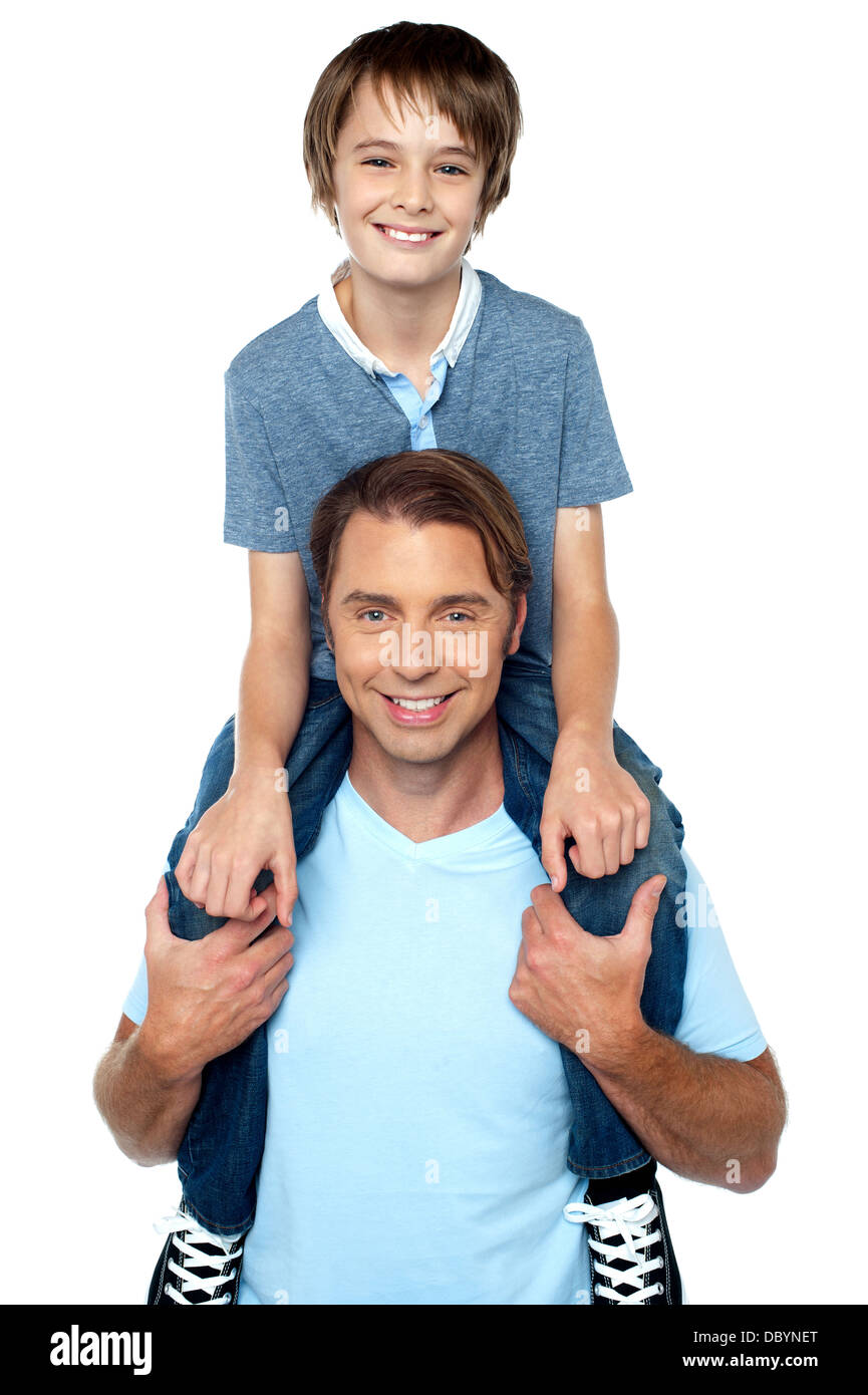 Adorable young son enjoying piggyback ride Stock Photo - Alamy