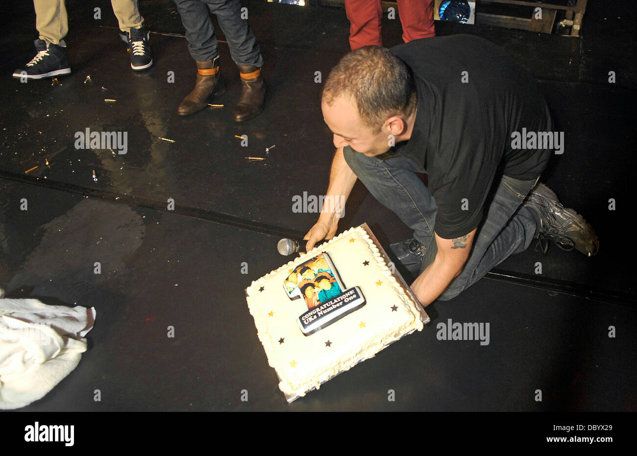 G-A-Y owner Jeremy Joseph brings out a cake to present to the group to ...