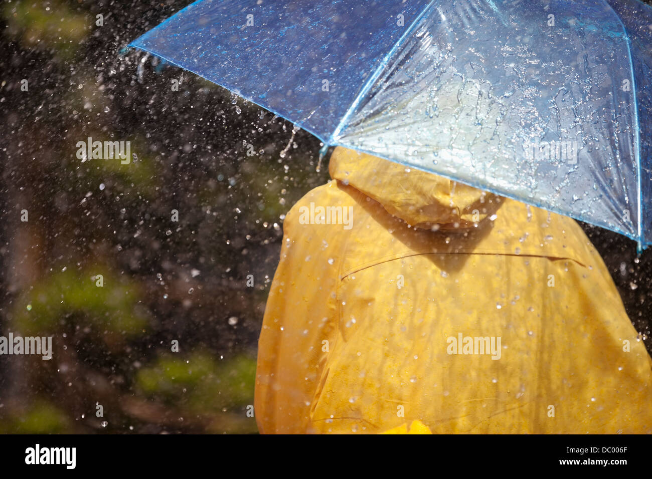 Woman standing under rain hi-res stock photography and images - Alamy