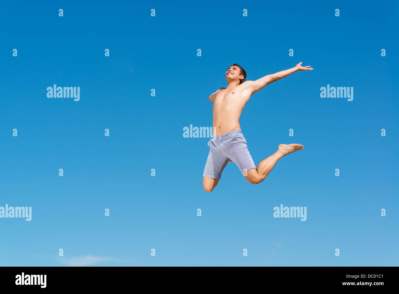 young man jumping Stock Photo - Alamy
