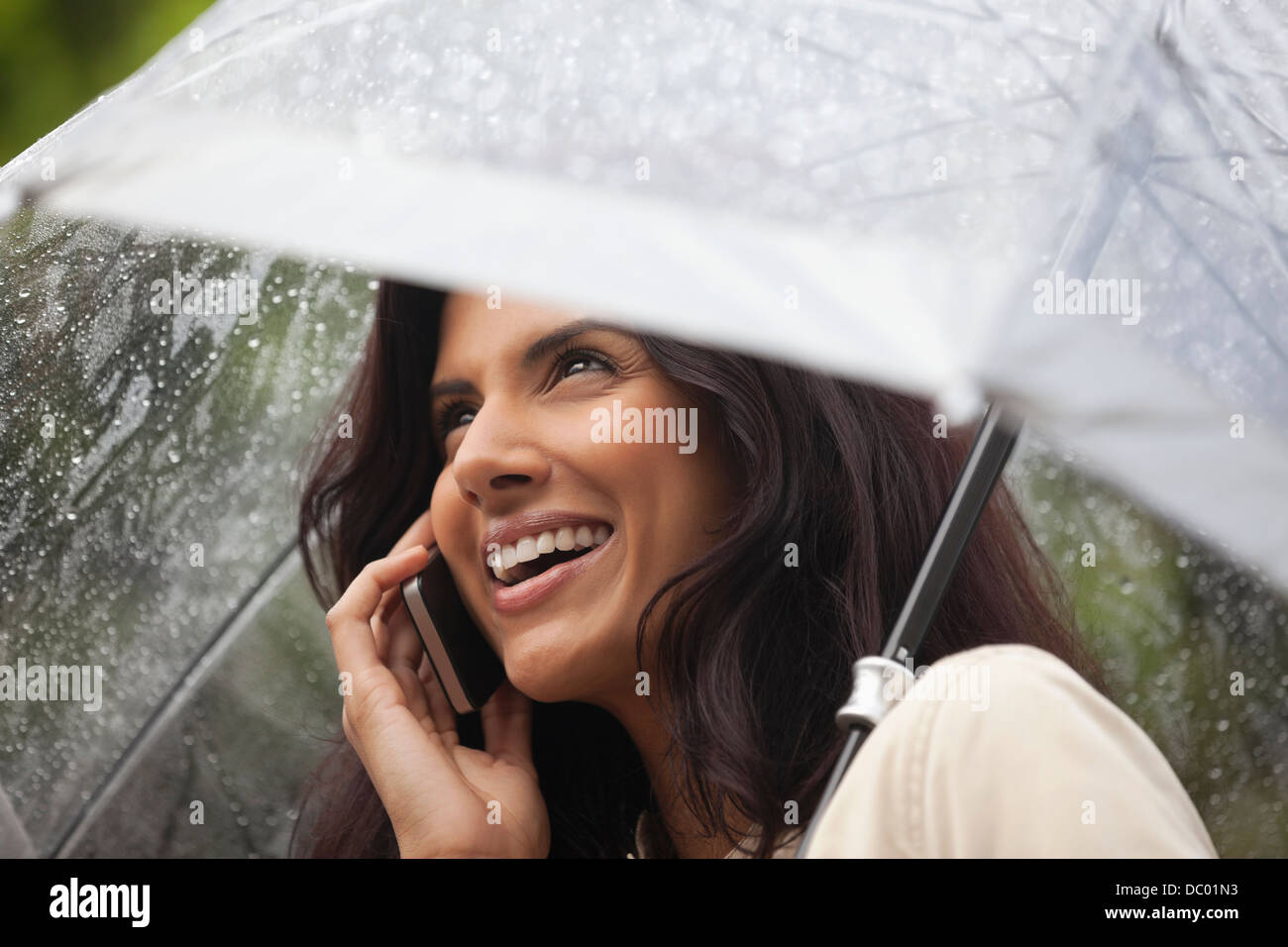 Woman rain mobile phone hi-res stock photography and images - Alamy