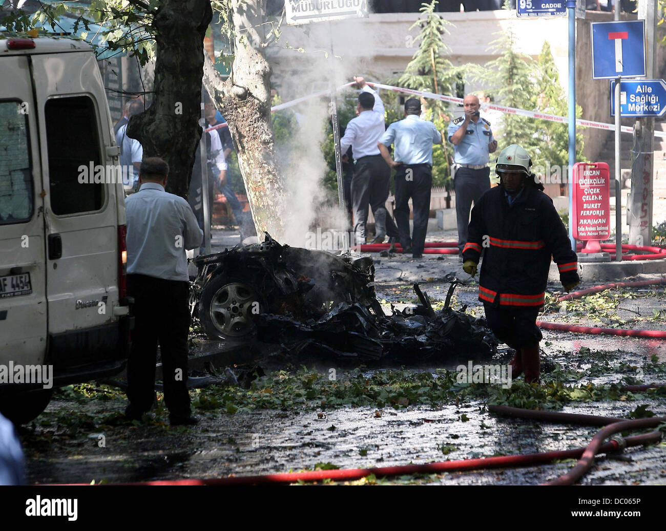 Turkish police officers, firefighters and forensic experts work the ...