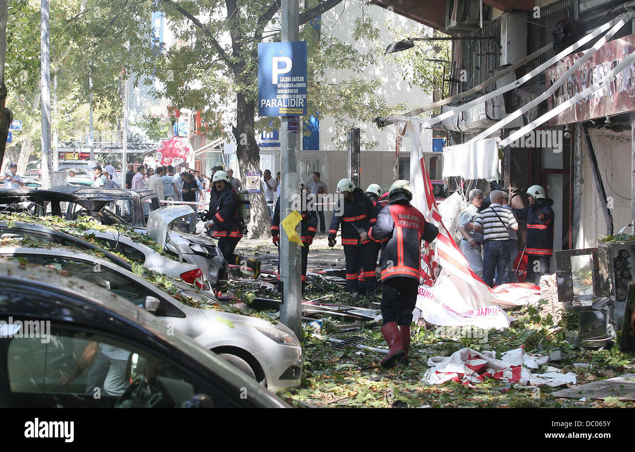 Turkish police officers, firefighters and forensic experts work the ...