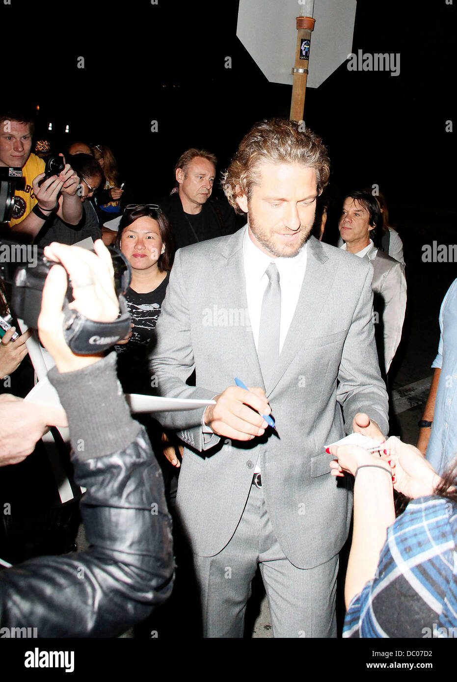 Gerard Butler signs autographs for fans at the 'Machine Gun Preacher ...
