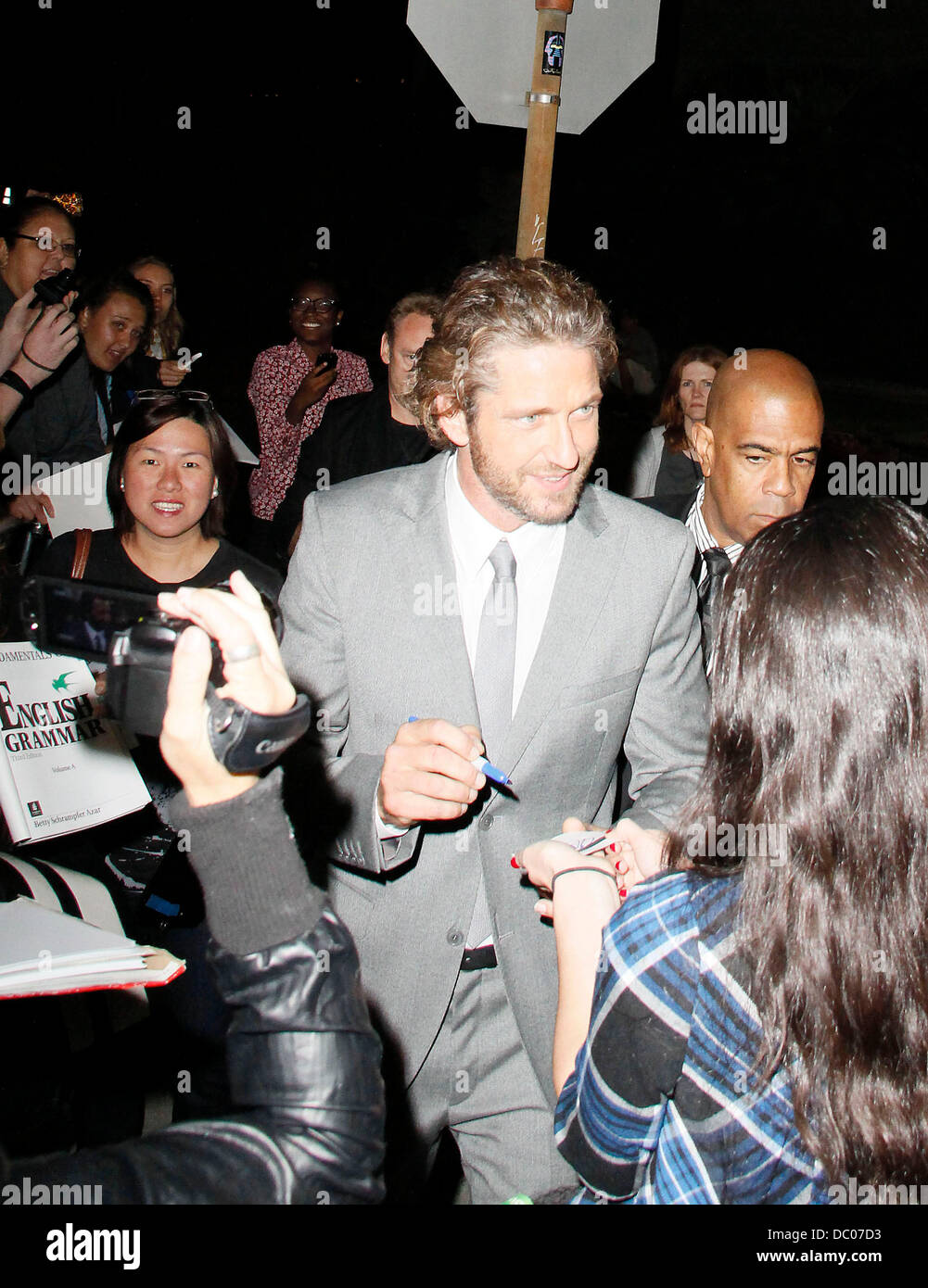 Gerard Butler signs autographs for fans at the 'Machine Gun Preacher ...