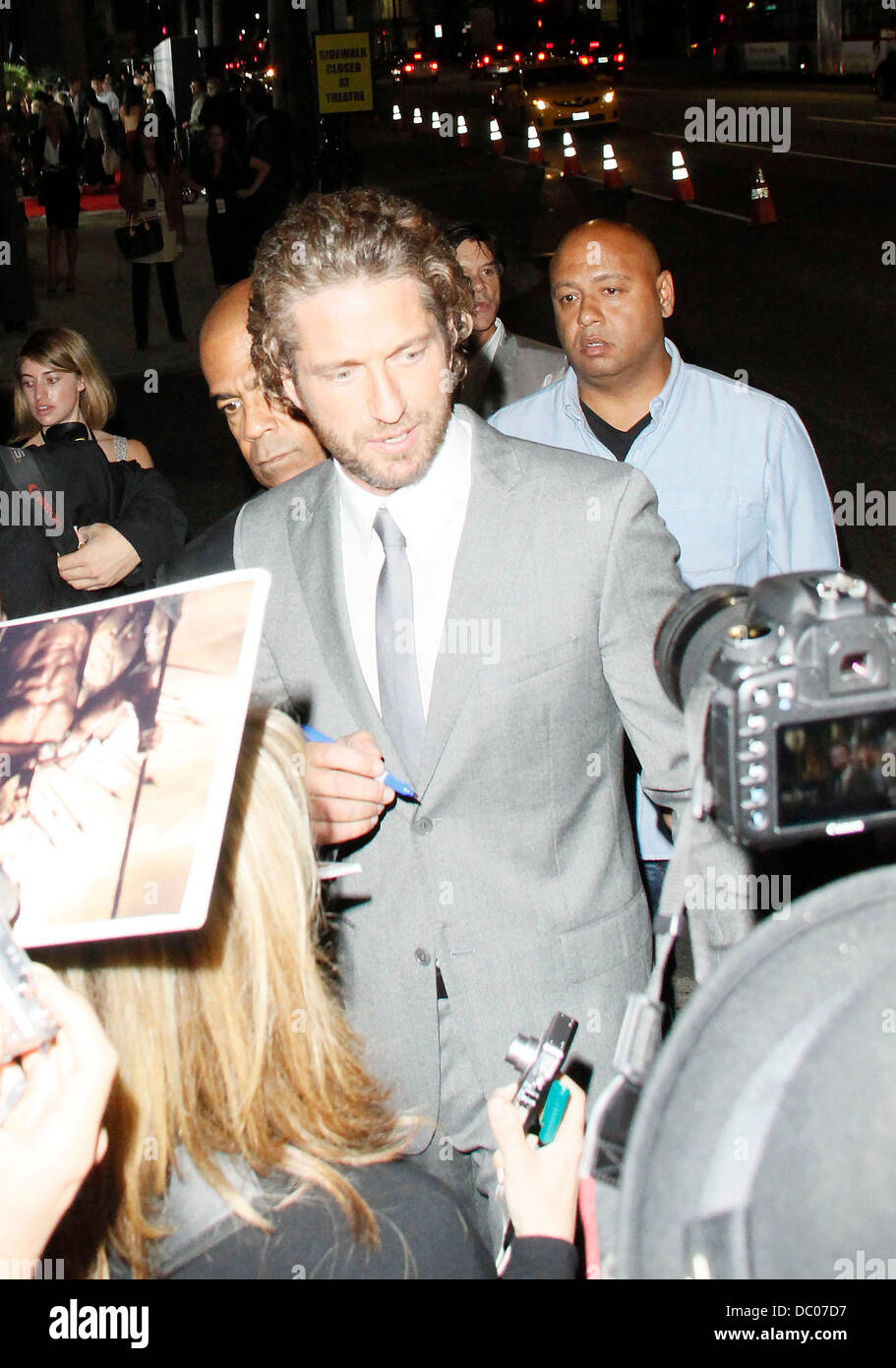 Gerard Butler signs autographs for fans at the 'Machine Gun Preacher ...